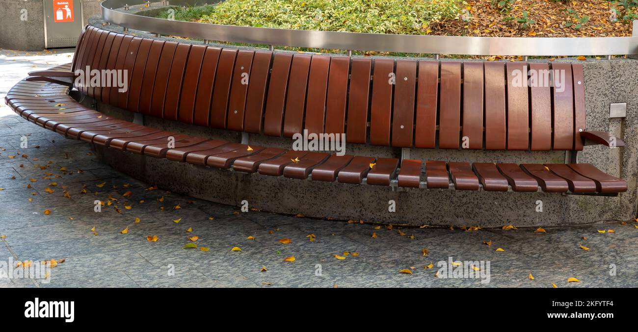 Rounded timber seating in front of a flower bed in Brisbane city mall ...