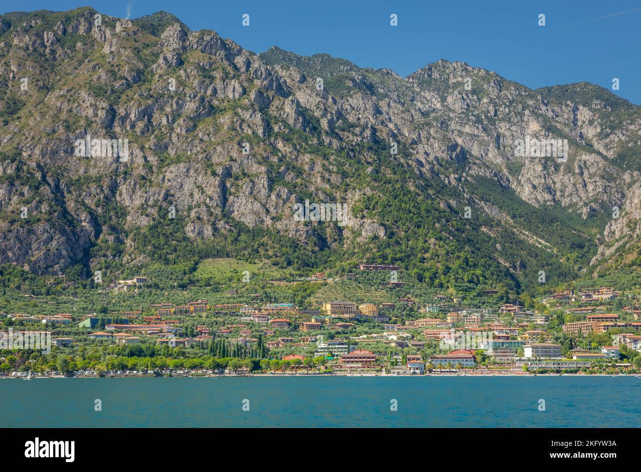 Idyllic Lake Garda and Limone sul Garda old town with boat, Italian ...