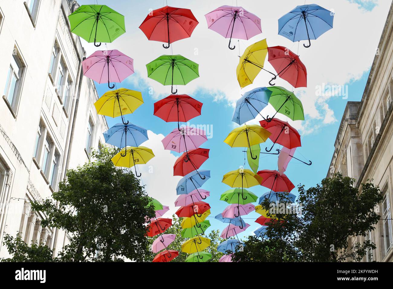 Umbrellas hanging in the sky above the street hi-res stock photography ...