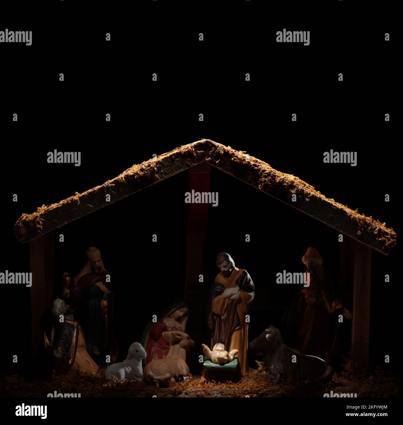 Dimly lit stable showing the Christian nativity scene with the baby ...