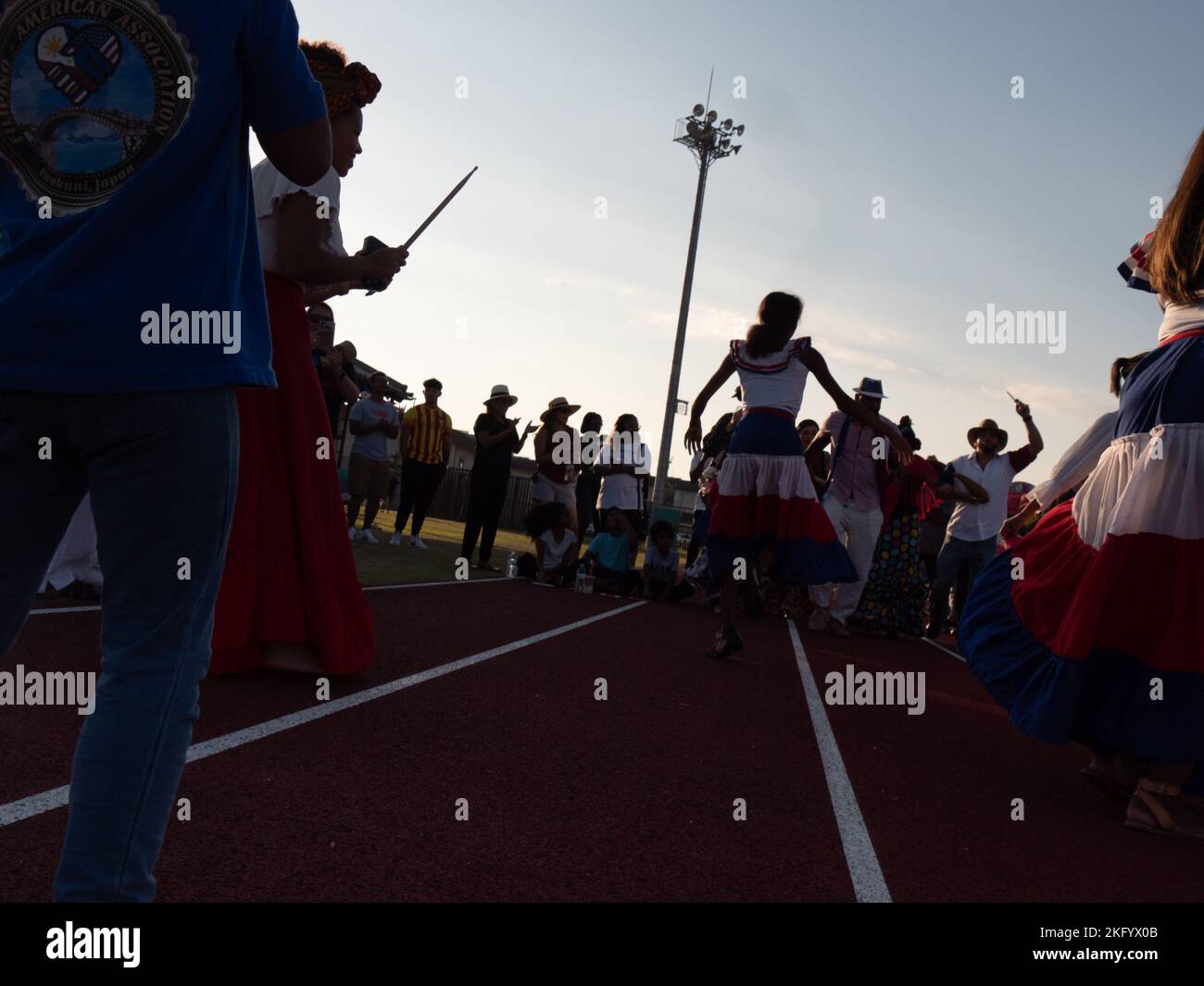 Performers and spectators sing and dance for the closing of the Marine ...