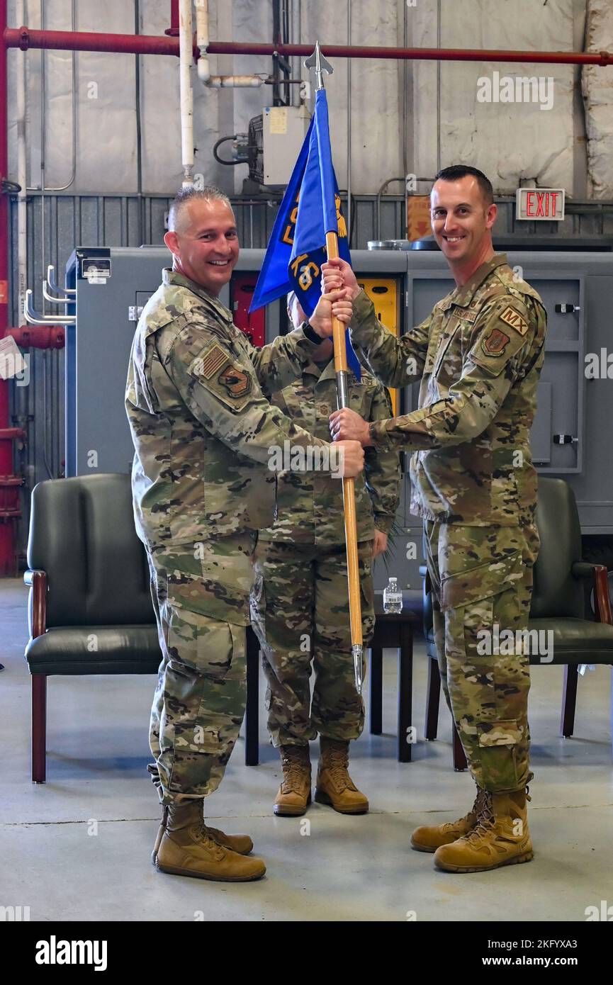 Capt. Ryan Yeager accepts the guide-on flag from Col. Terry Rosenbalm ...