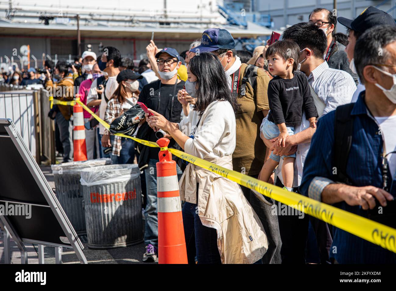 221016-N-XU073-1294 YOKOSUKA, Japan (Oct. 16, 2022) Japanese guests wait in line to board U.S ...