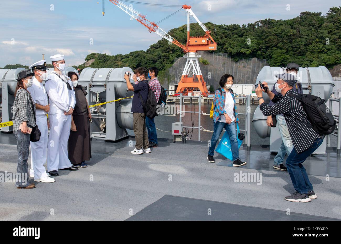 YOKOSUKA, Japan (Oct. 16, 2022) – Sailors pose for a photograph with ...