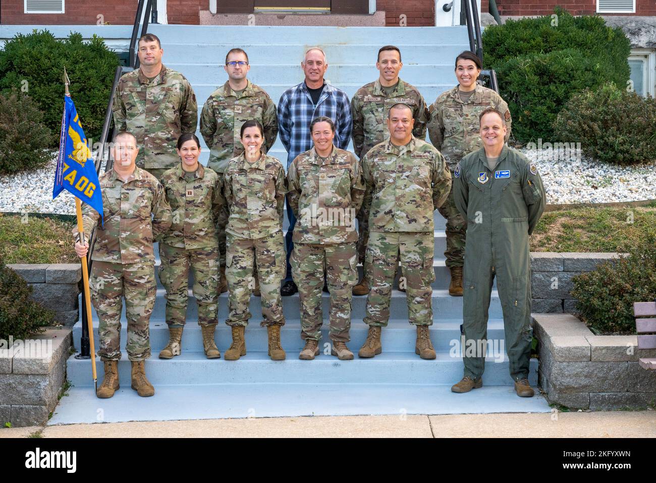 Staff members of the 157th Air Operations Group (AOG) stand for a group ...