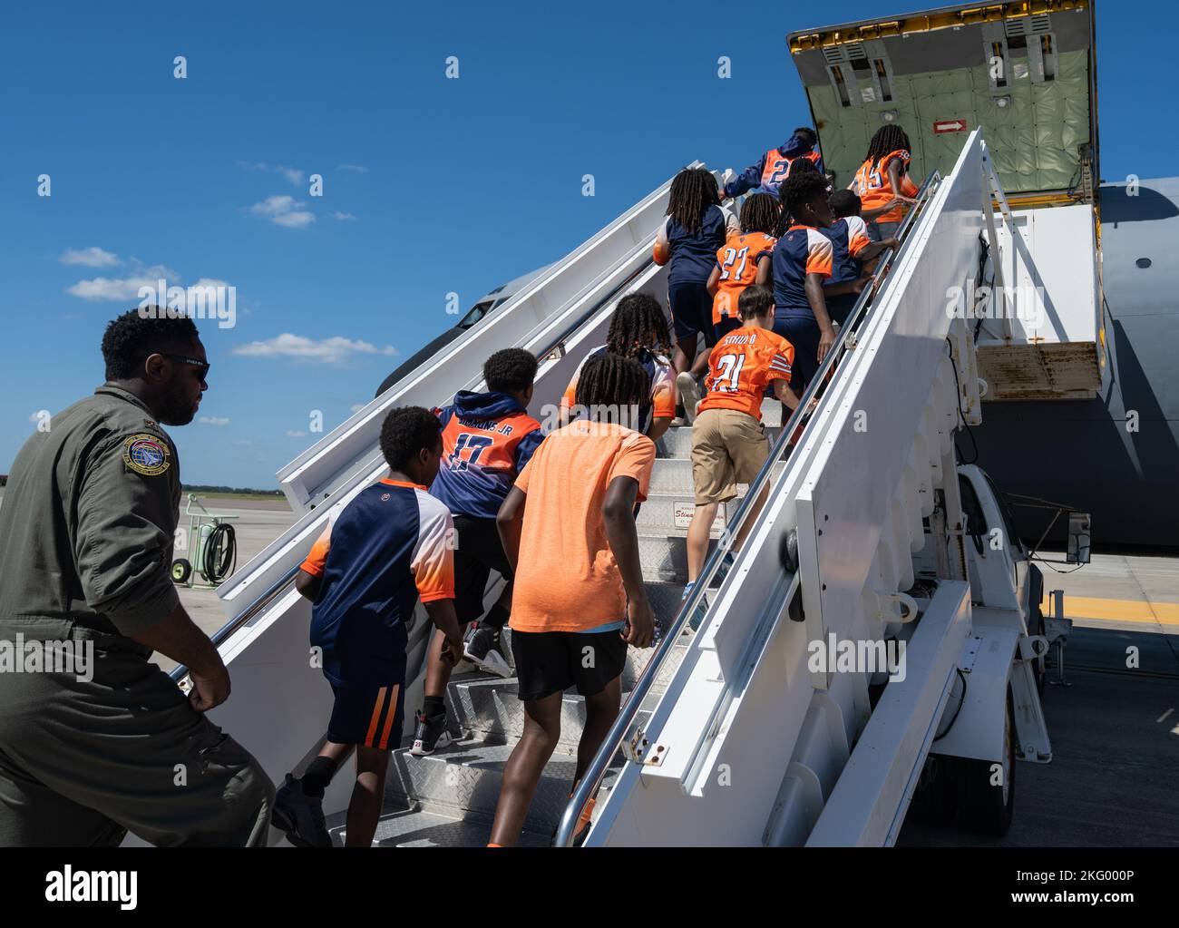 Students from the Brandon Bears Youth Football team climb a set of ...