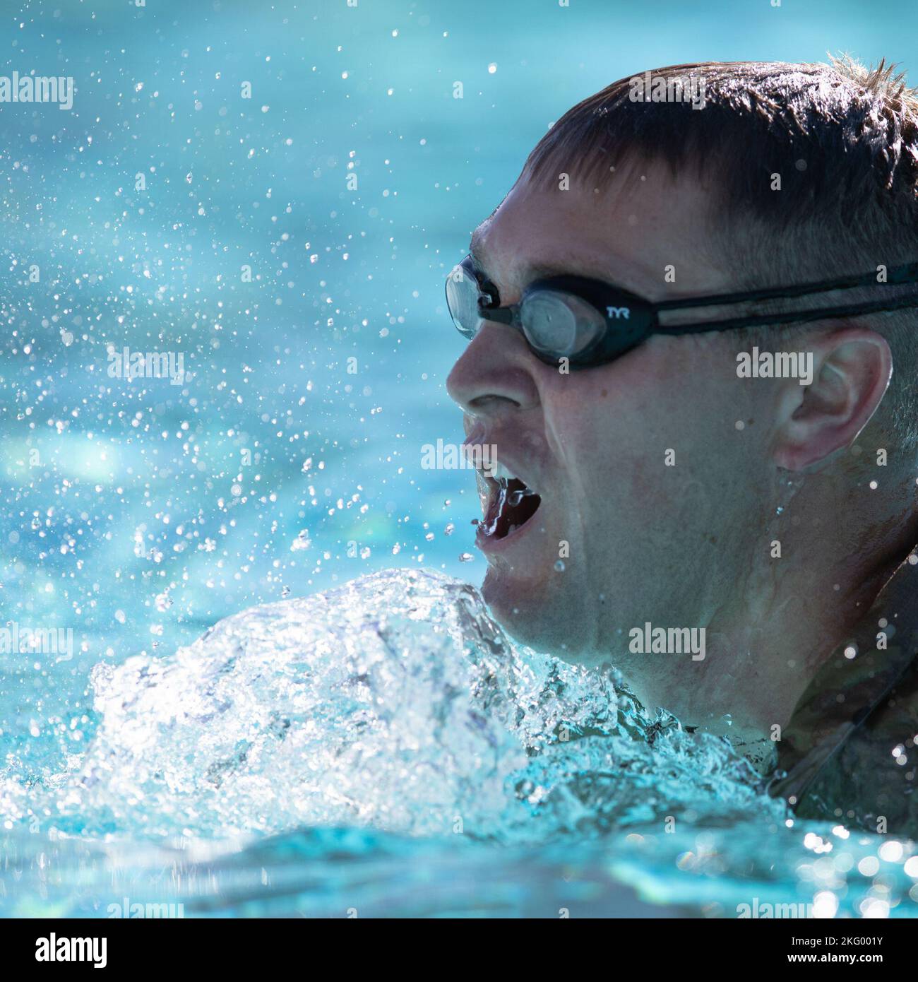 Staff Sgt. Nathan Woods with 97th Troop Command, takes a breath during ...