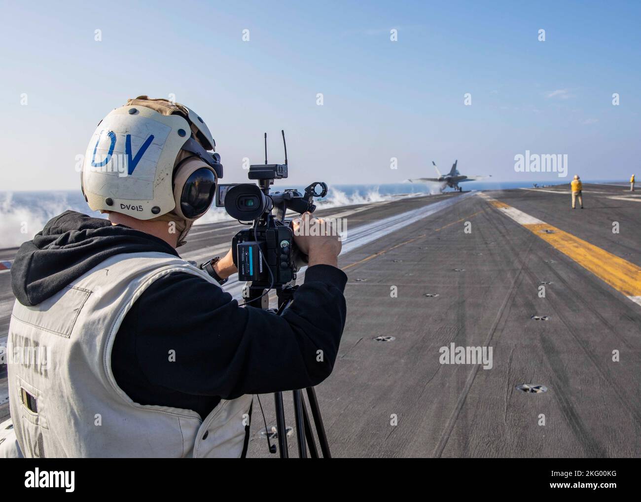 221017-N-MW880-1214 ADRIATIC SEA (Oct. 17, 2022) A member of the media captures video of flight ...