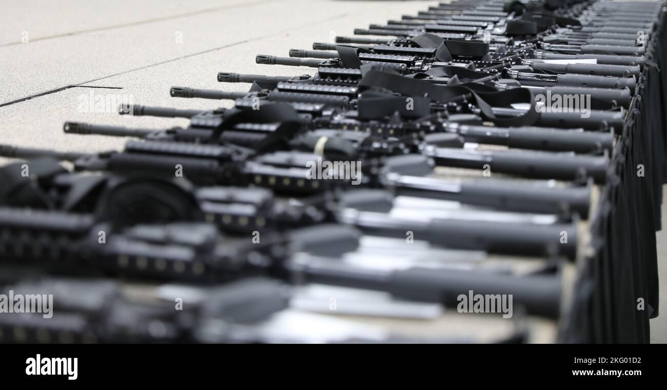 U.S. Military issued M4 carbine rifles are lined up and ready for ...