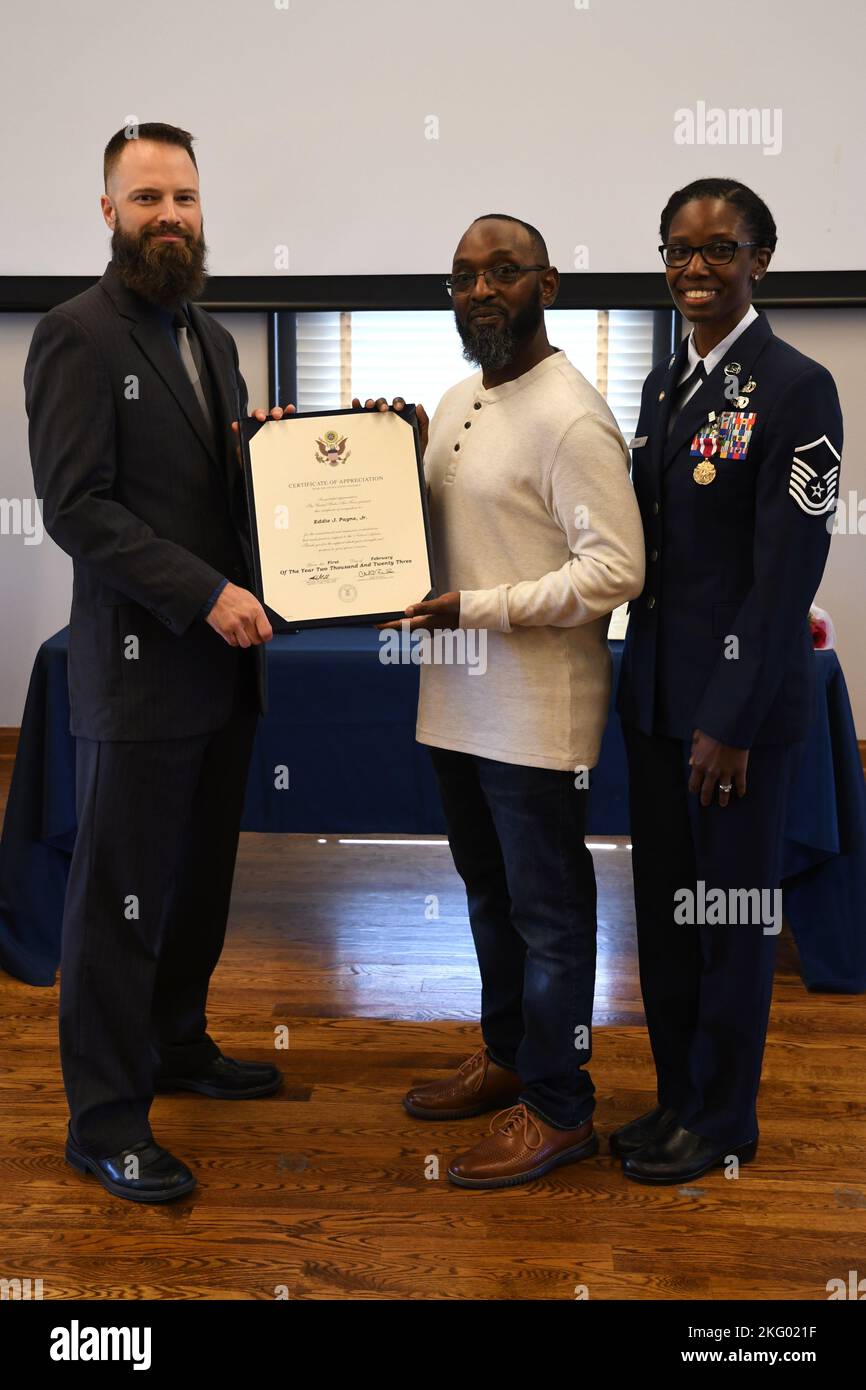 Master Sgt. Jacqueline Payne's husband is presented with a Certificate ...