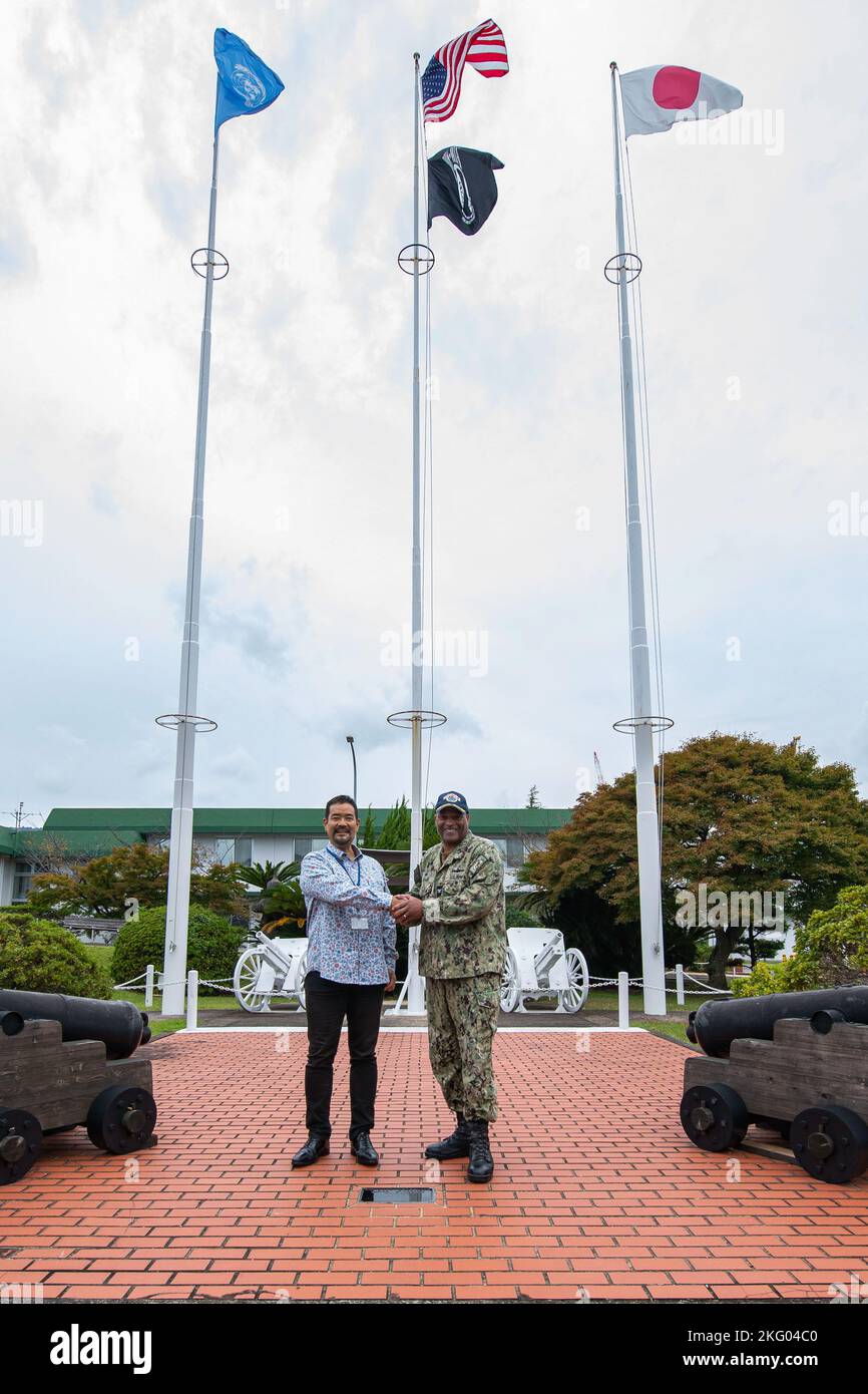 Capt. David Adams, Commander, Fleet Activities Sasebo (CFAS), poses for ...