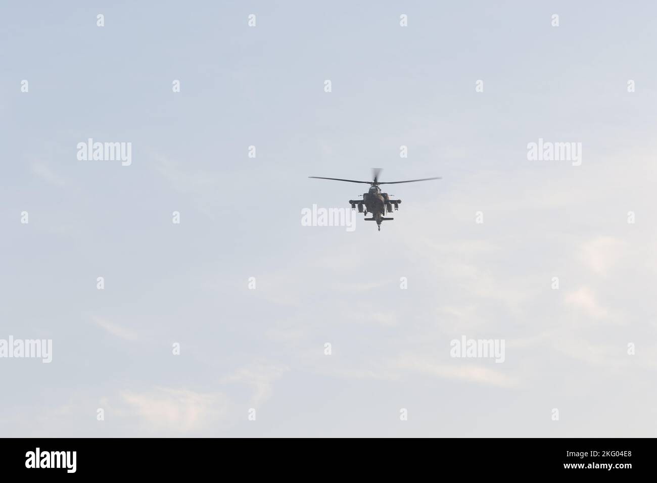 One of two U.S. Army AH-64E Apache helicopters conducts a flyover of ...