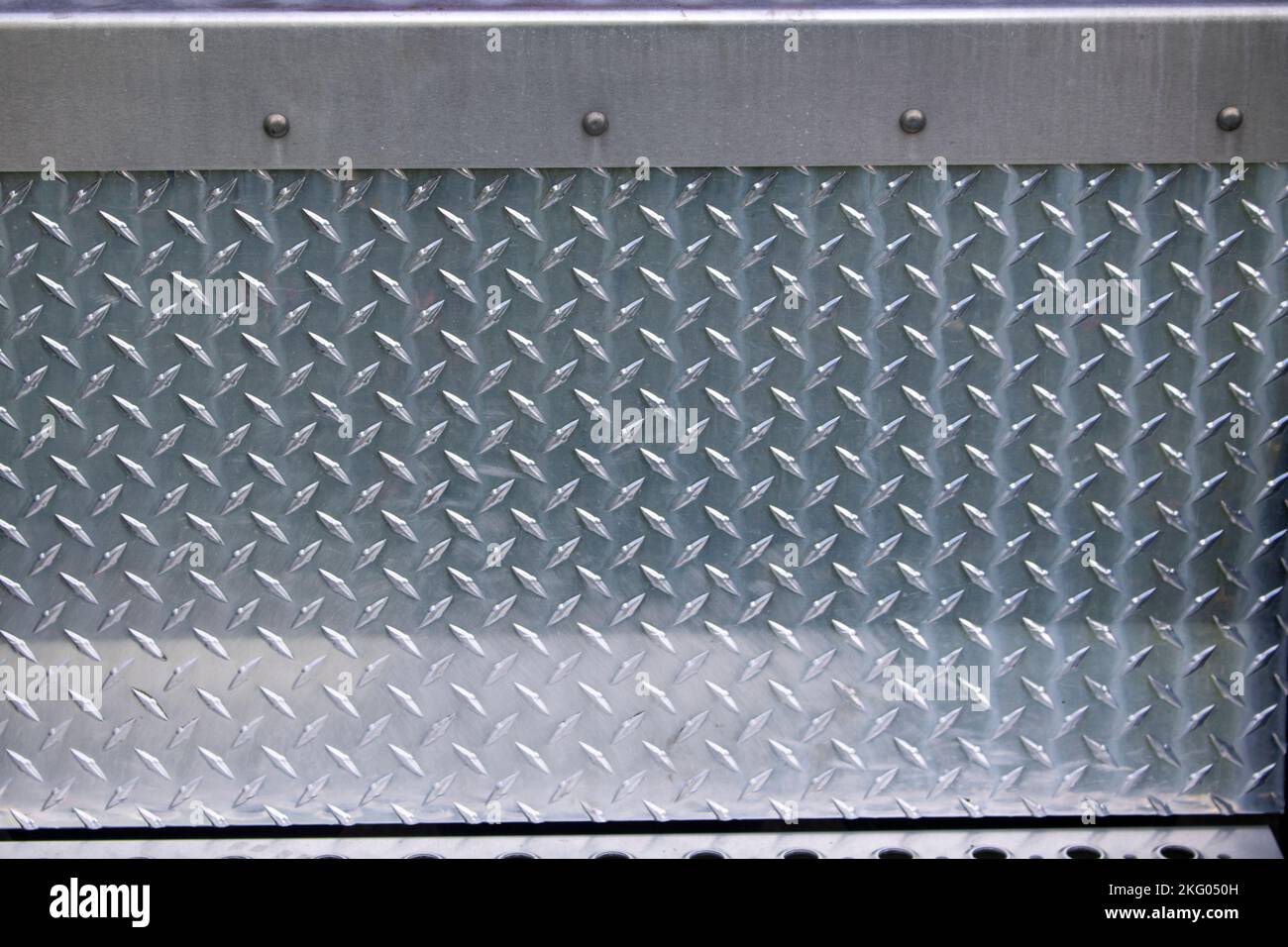 diamond steel plate with rivitted corner steel Stock Photo - Alamy