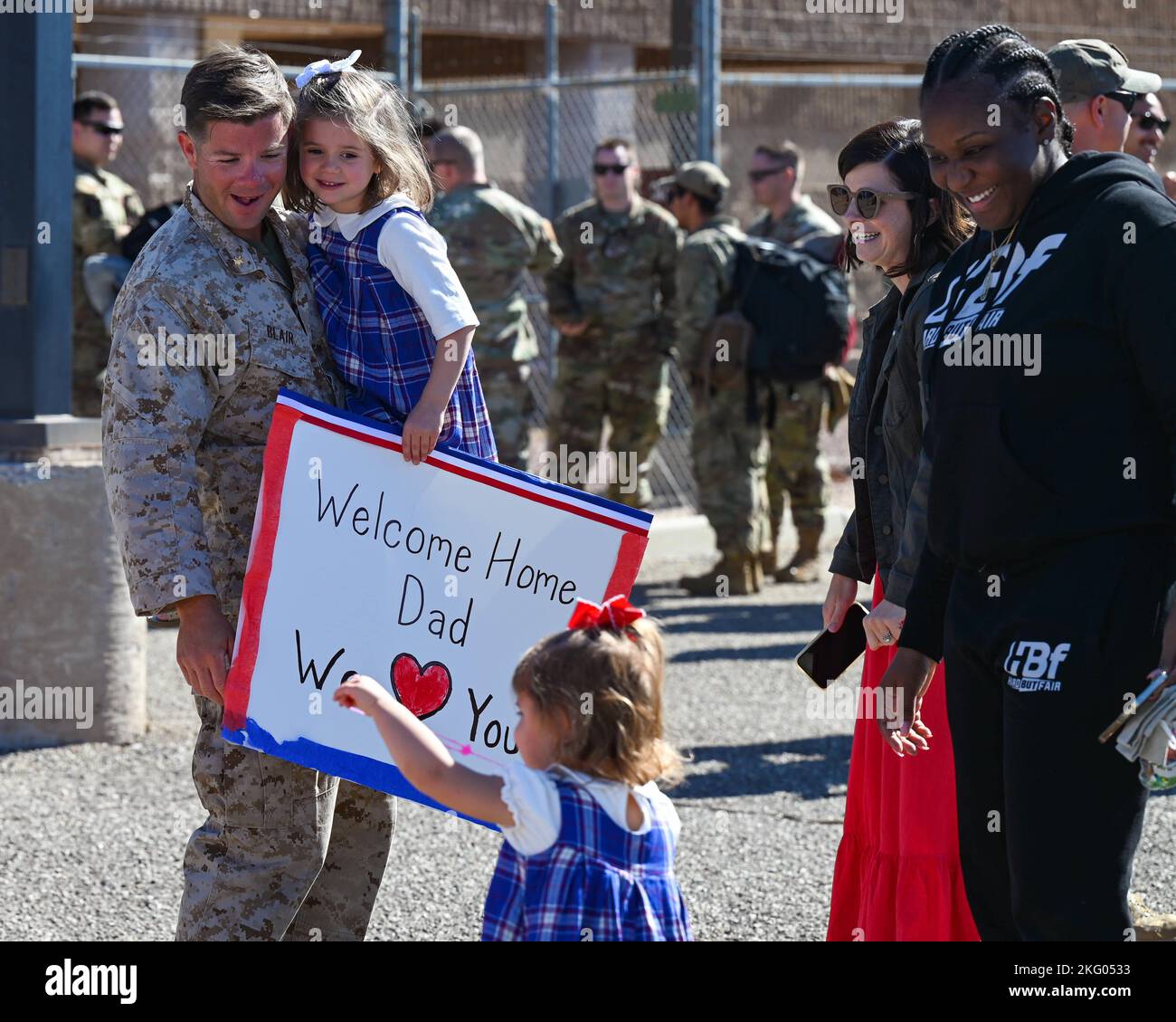 A Marine holds his daughter after returning from a deployment at an ...