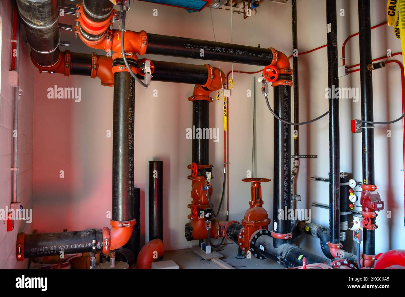 Pipes crisscross a fire pump room inside the Central Utility Plant in ...