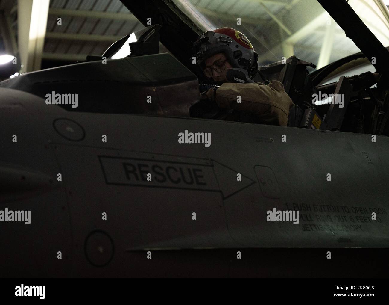 A U.S. Air Force Pilot from the 77th Fighter Squadron (77th FS) dons ...