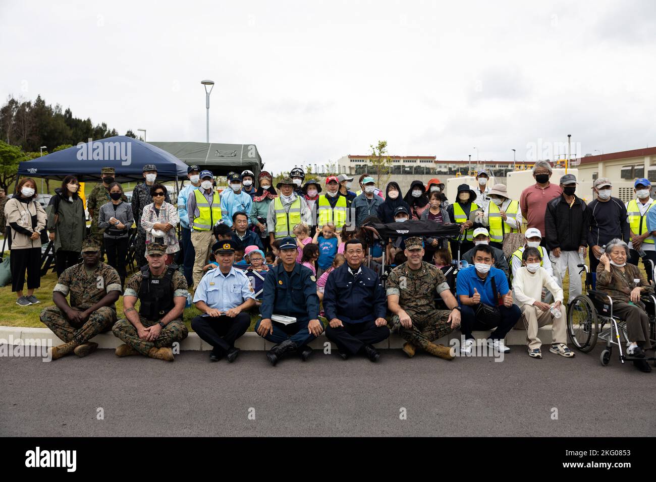U.S. Marines, participants, and local Japanese residents pose for a ...