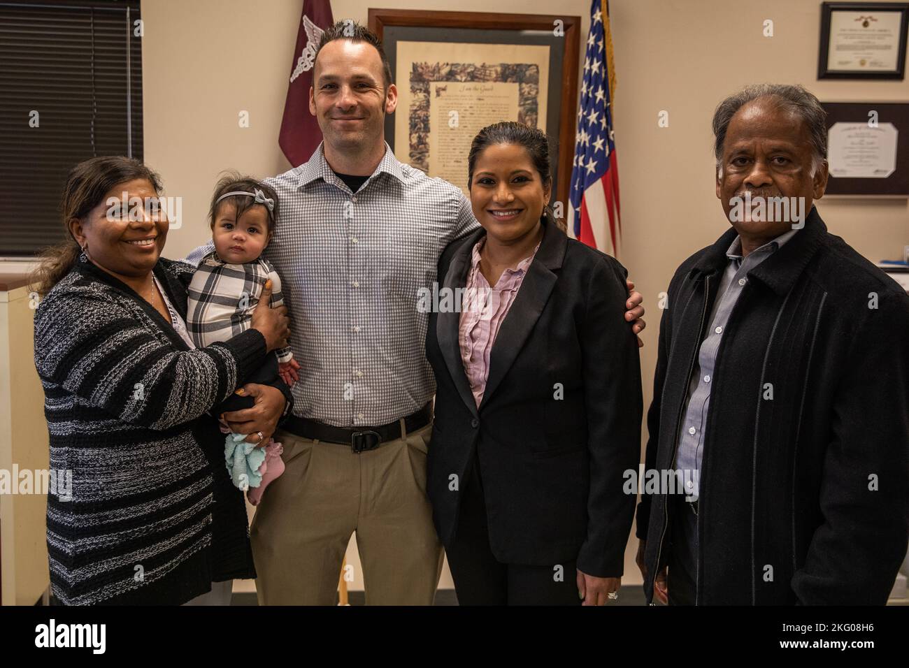 Army Capt. Sara Powell poses with her family at the Boone National ...