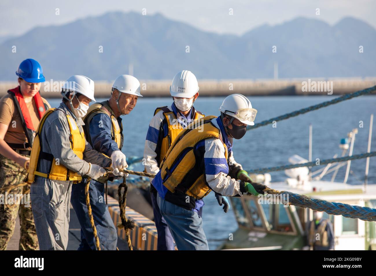 Marine Corps Air Station Iwakuni personnel pull the line to the vehicle ...