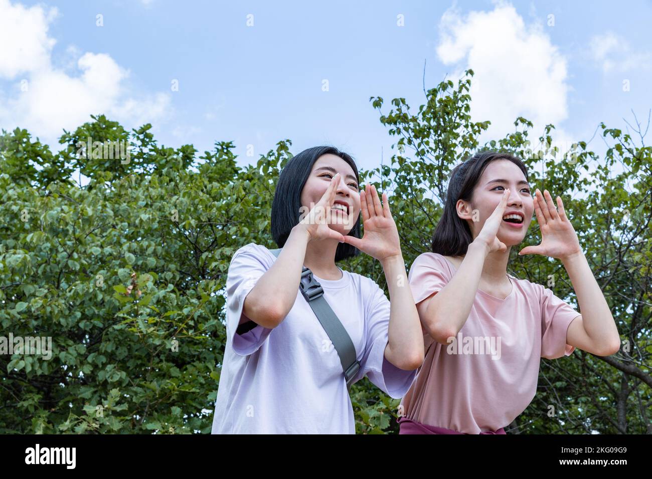 Female friends shouting standing hi-res stock photography and images ...