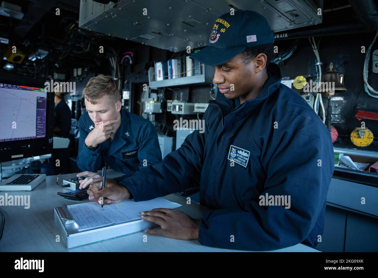 221018-N-LK647-1004 ATLANTIC OCEAN—Quartermaster 3rd Class Ronald Brown and Quartermaster 2nd ...