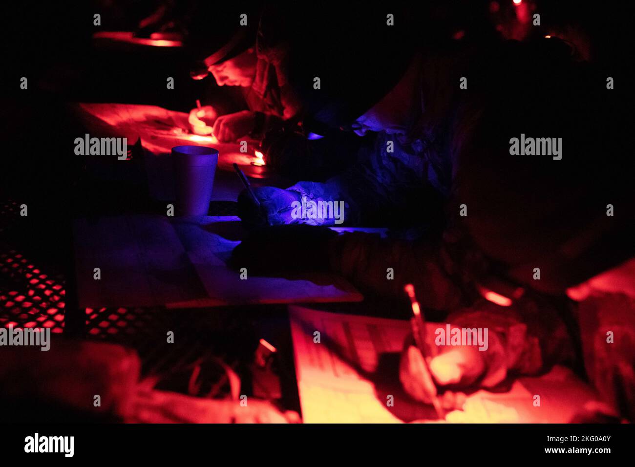 Staff Sgt. Nathan Woods with the 97th Troop Command pinpoints his night ...