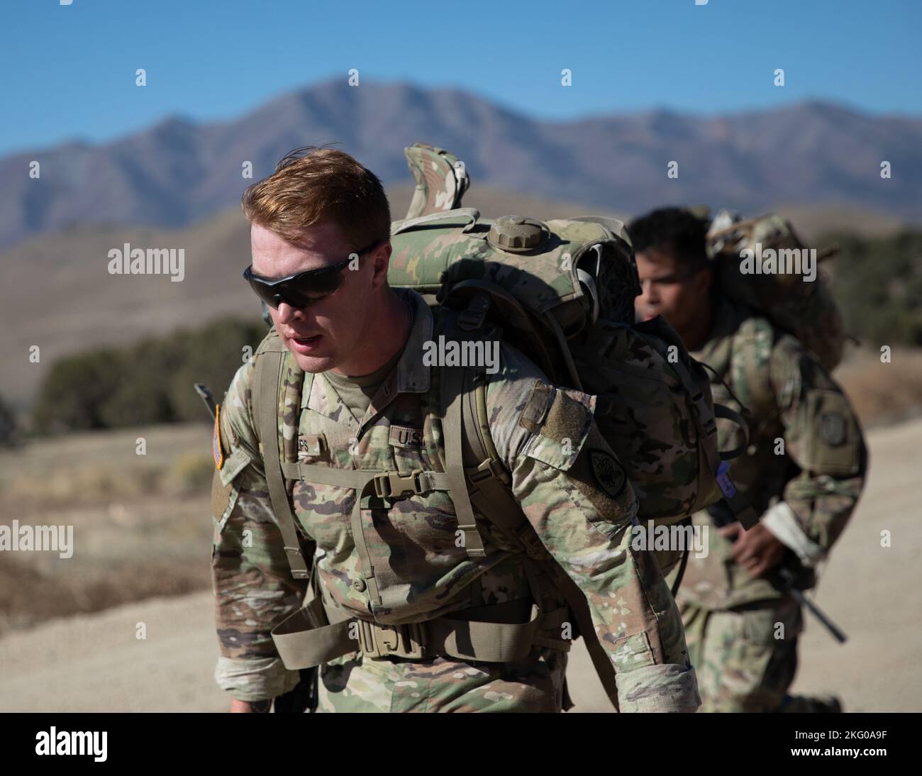 Spc. Logan Phillips, representing the 97th Troop Command, run down the ...