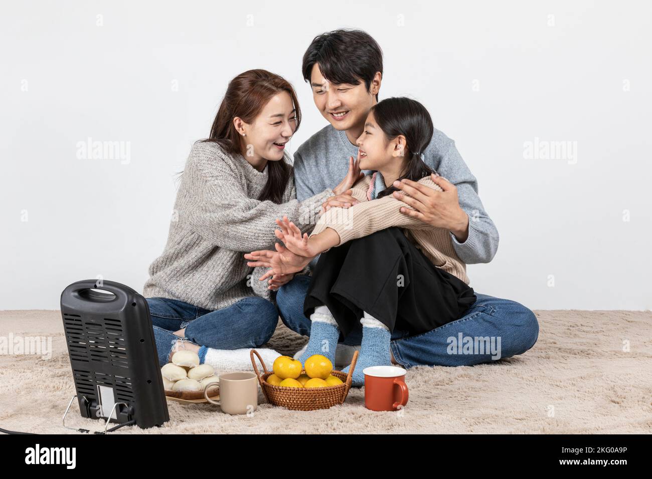 happy Asian Korean family, isolated in white background warm oneself at ...