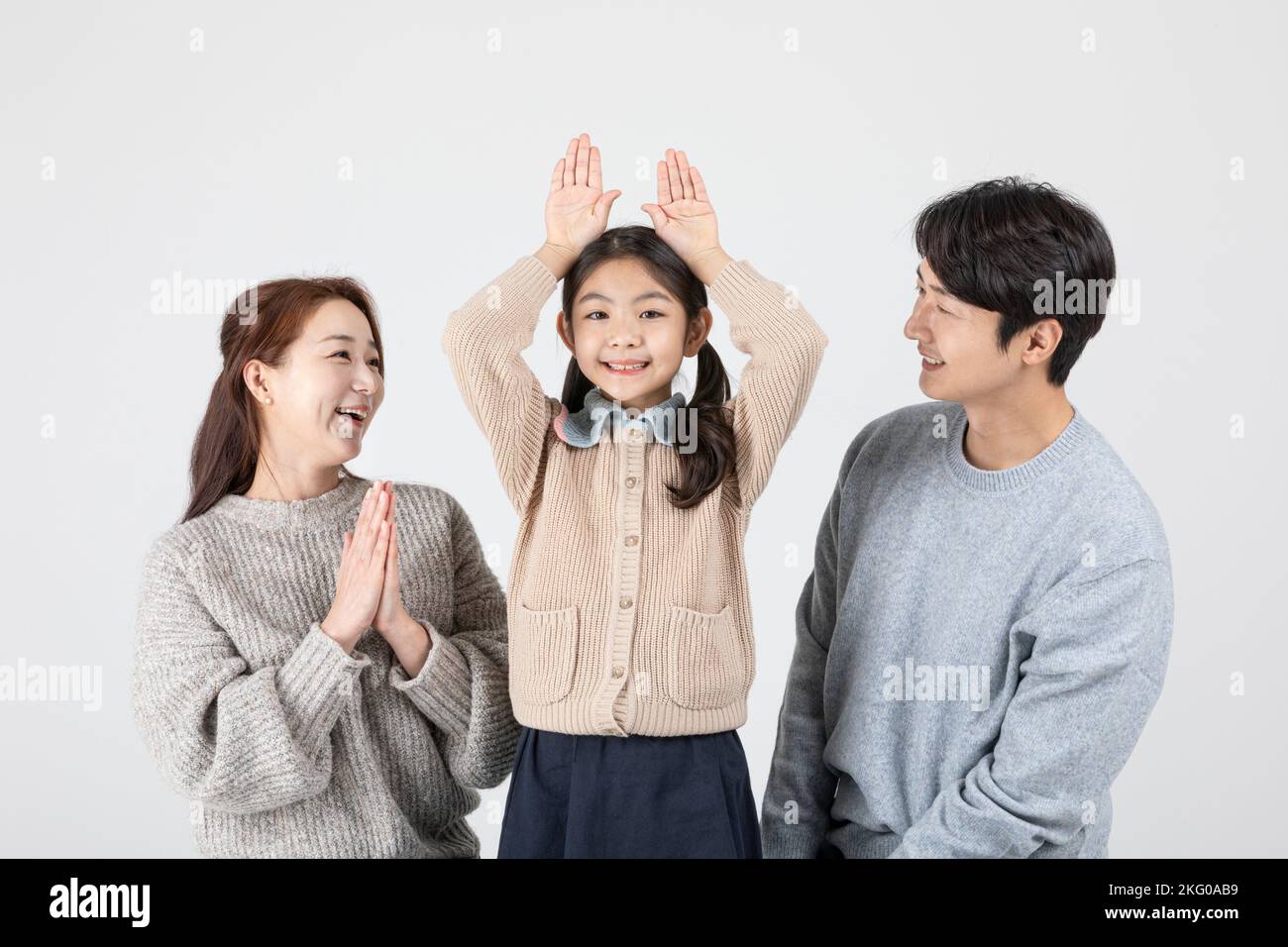 happy Asian Korean family, isolated in white background rabbit ears ...