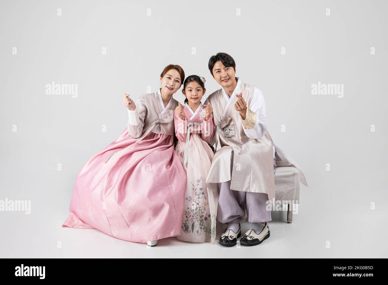 Korean family in Hanbok, isolated white background hand motion Stock ...