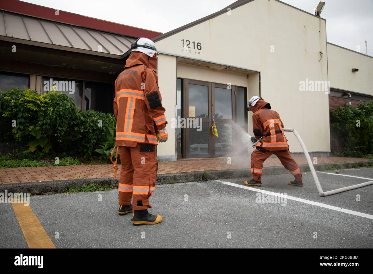 A firefighter with the Urasoe Fire Department training scenario on Camp ...