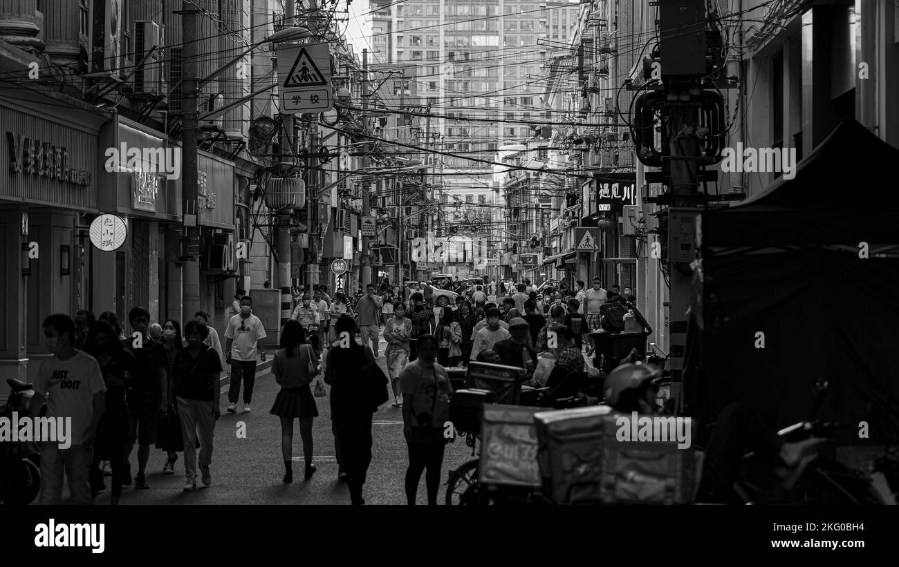 A bustling old-style alley in modern Shanghai Stock Photo - Alamy