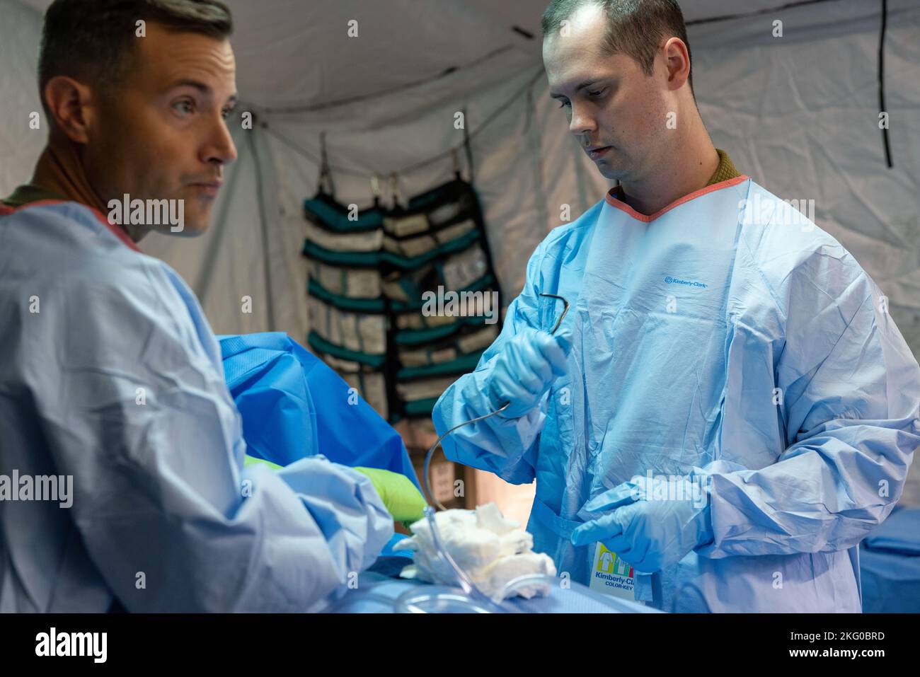 U.S. Navy Lt. Cmdr. Luke Johnson, left, and Lt. Cmdr. Ryan Fitzgerald ...