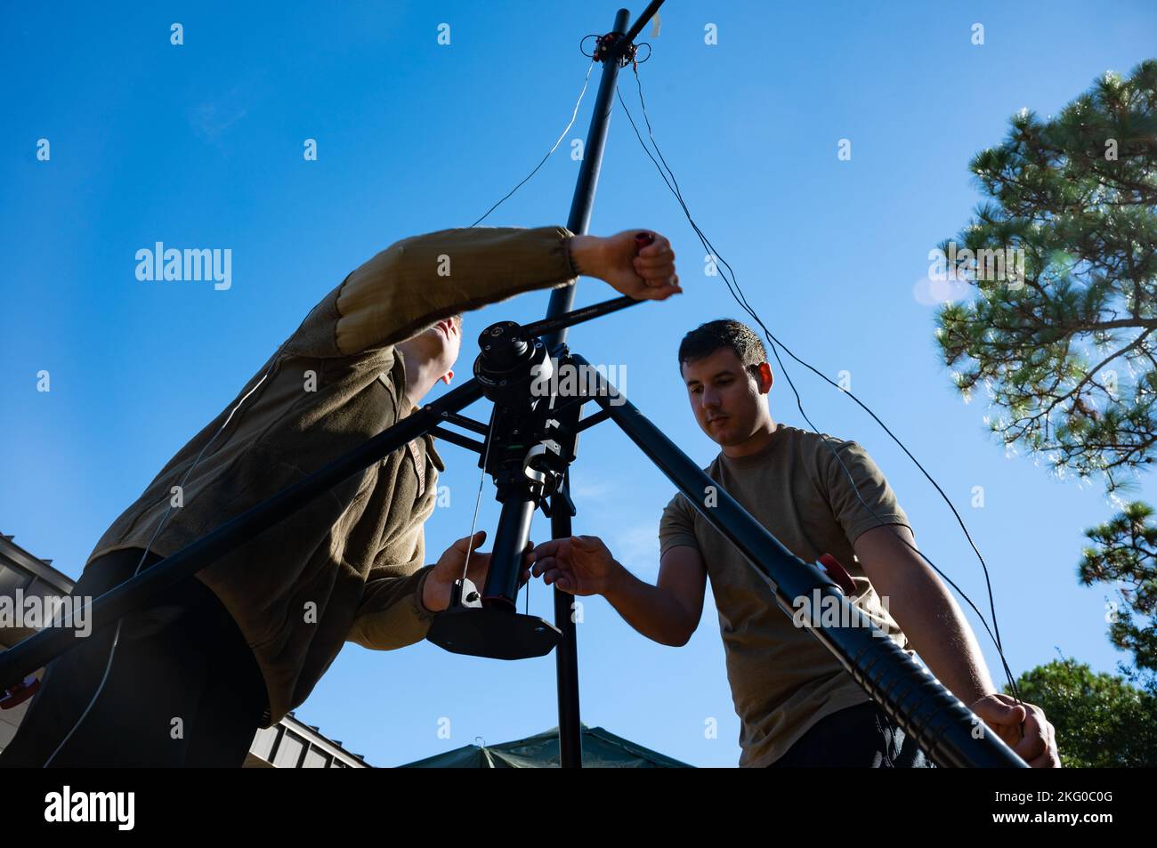 Mission Support Radio airmen set up a line-of-sight antenna to send and ...