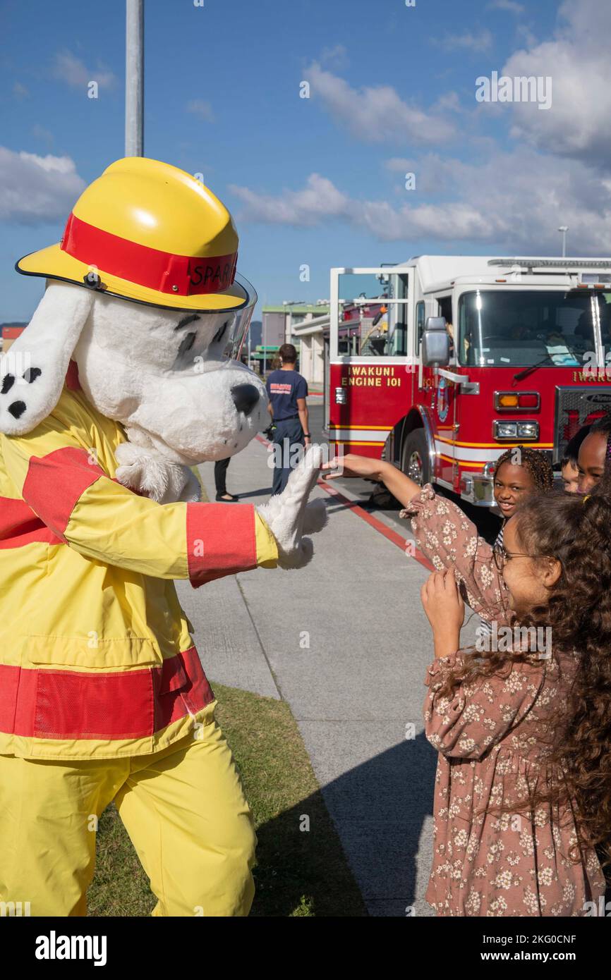 Sparky, the National Fire Protection Association mascot, high-fives a ...
