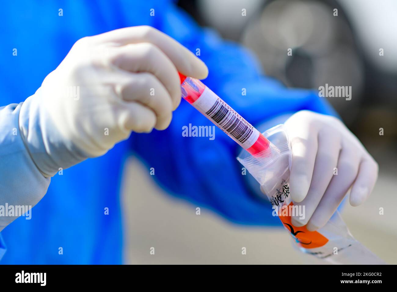 HOHHOT, CHINA - NOVEMBER 21, 2022 - A medical worker carries out ...