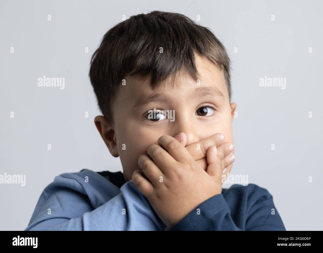 Male boy about 4 years old expressing emotions with his hands on his ...