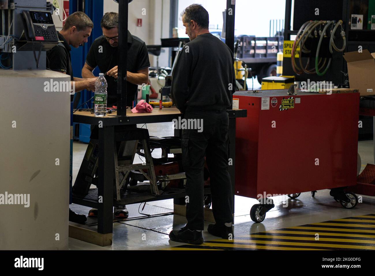 Portuguese local nationals work to repair vehicle parts at Lajes Field ...