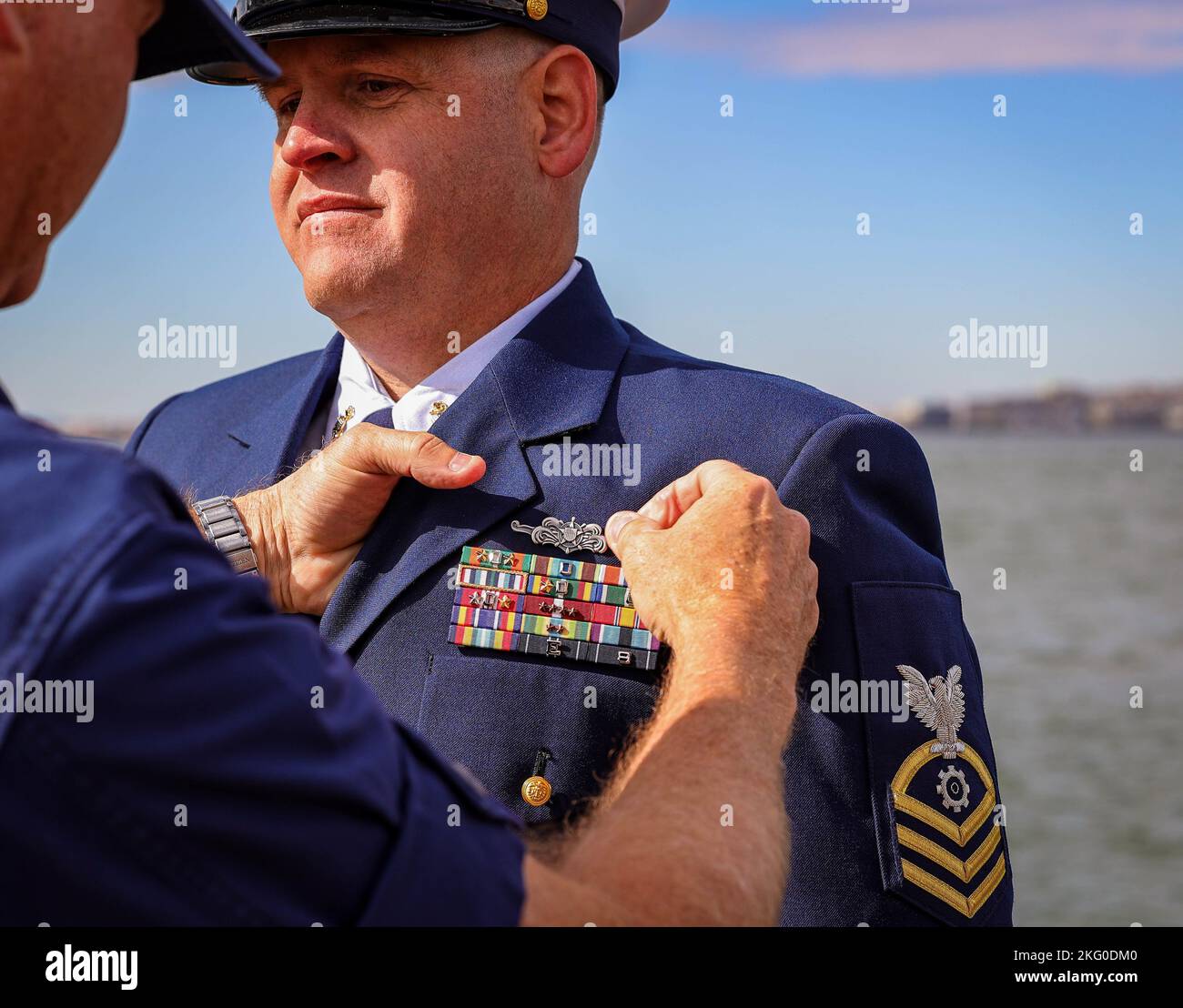 U.S. Coast Guard Machinery Technician Richard Gauthier is presented the ...