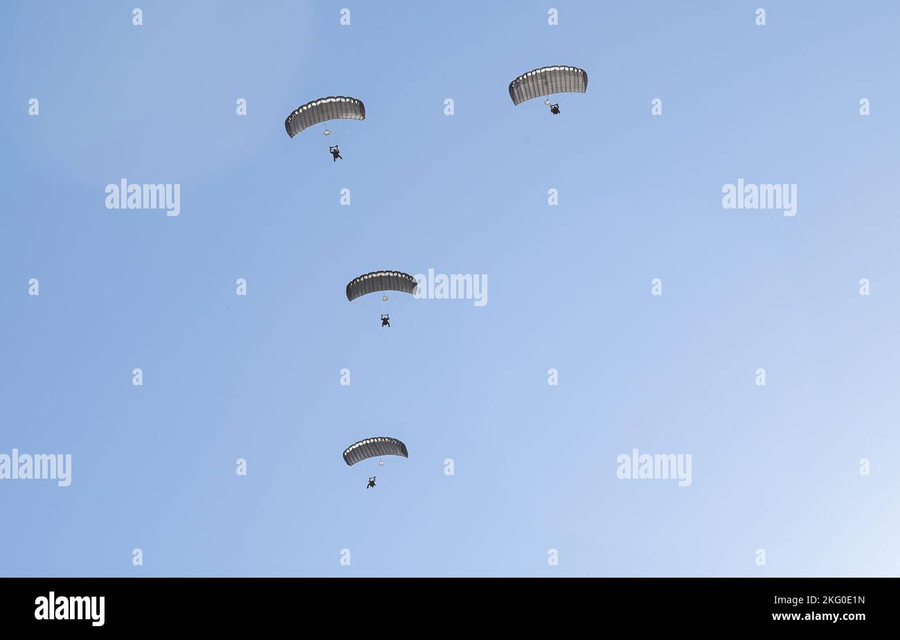 Four U.S. Air Force pararescuemen, assigned to the 52nd Expeditionary ...