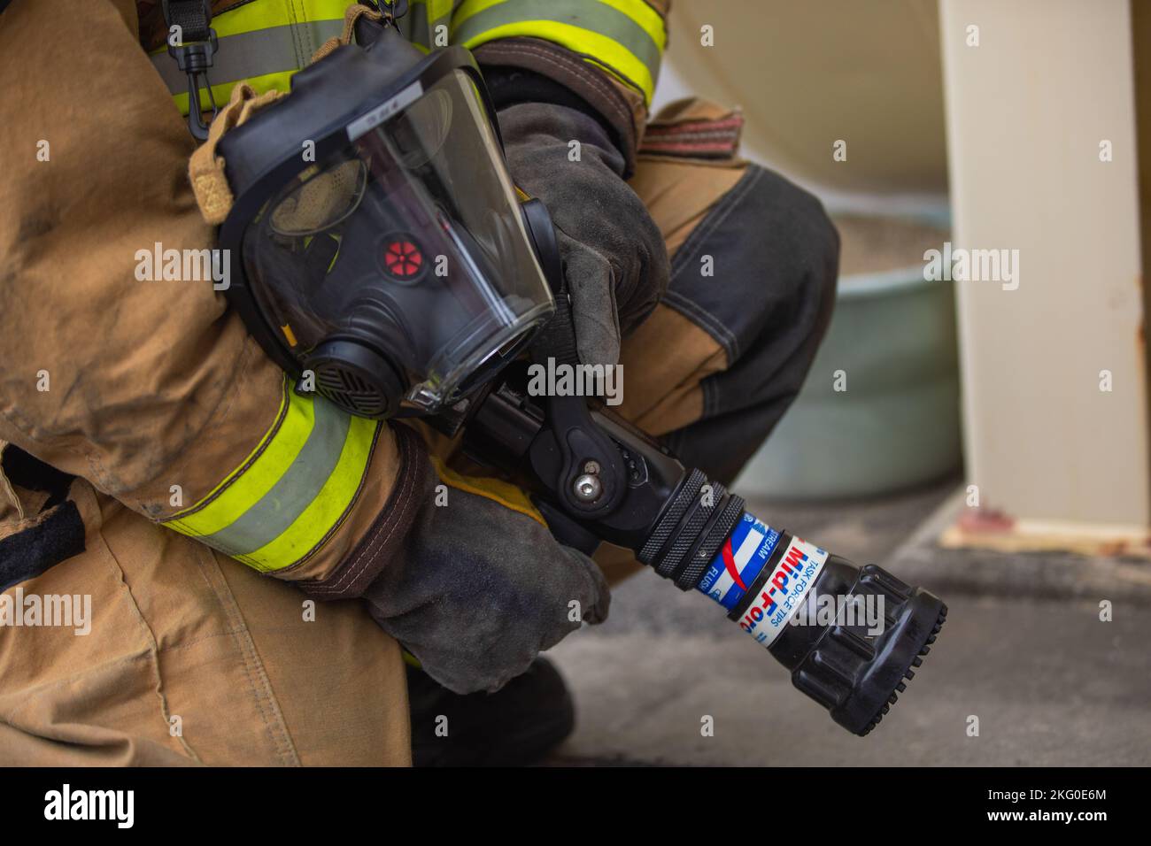 A firefighter with Marine Corps Installations Pacific Fire and ...