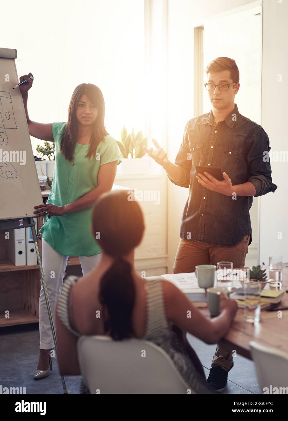 Bright minds at work. a group of coworkers in a boardroom meeting Stock ...