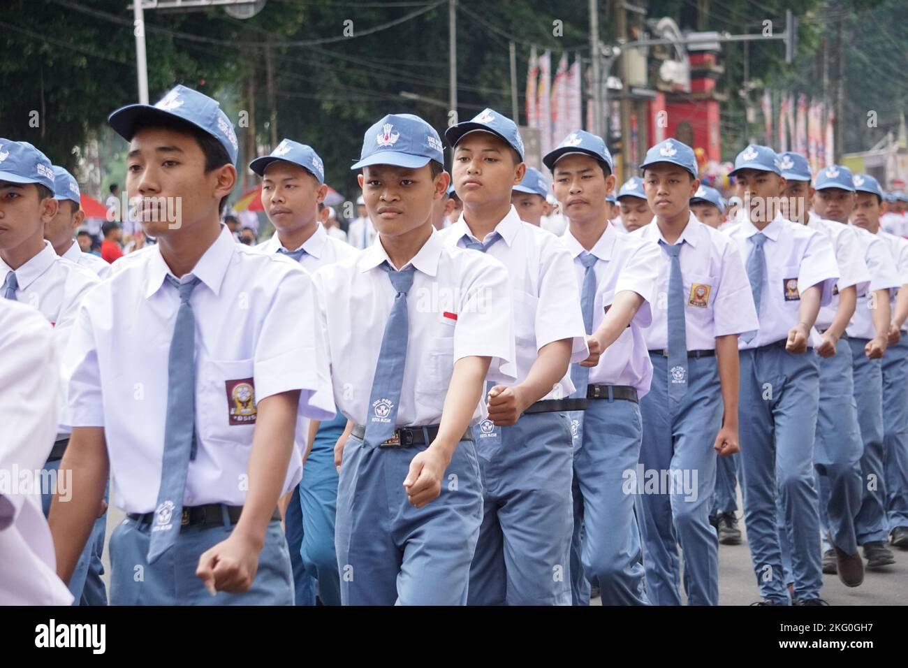 Indonesian senior high school students with uniforms, marching to ...
