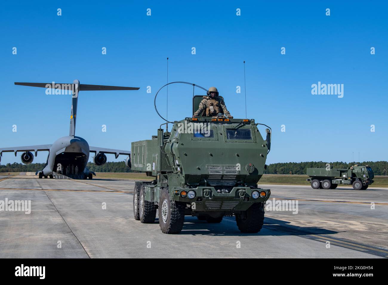 U.S. service members finish setting up a High Mobility Artillery Rocket ...