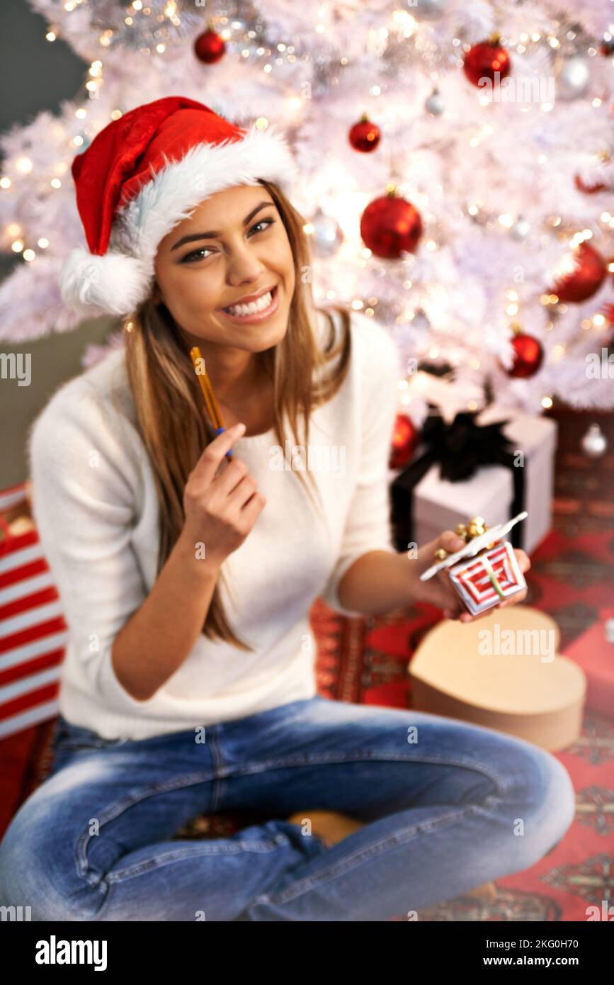 Christmas presents with love. Portrait of a beautiful young woman ...