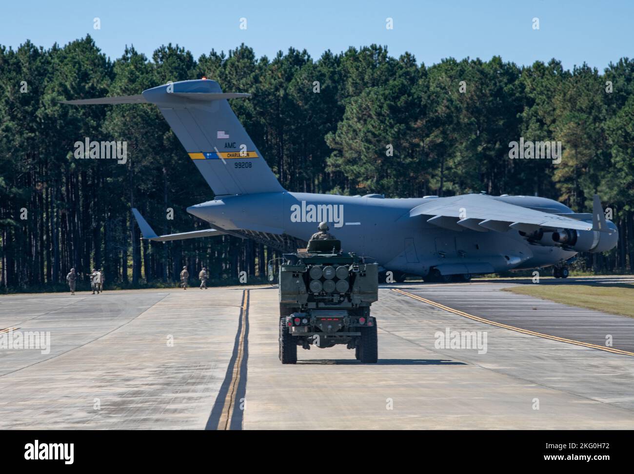 U.S. Marines prepare to load a High Mobility Artillery Rocket System ...