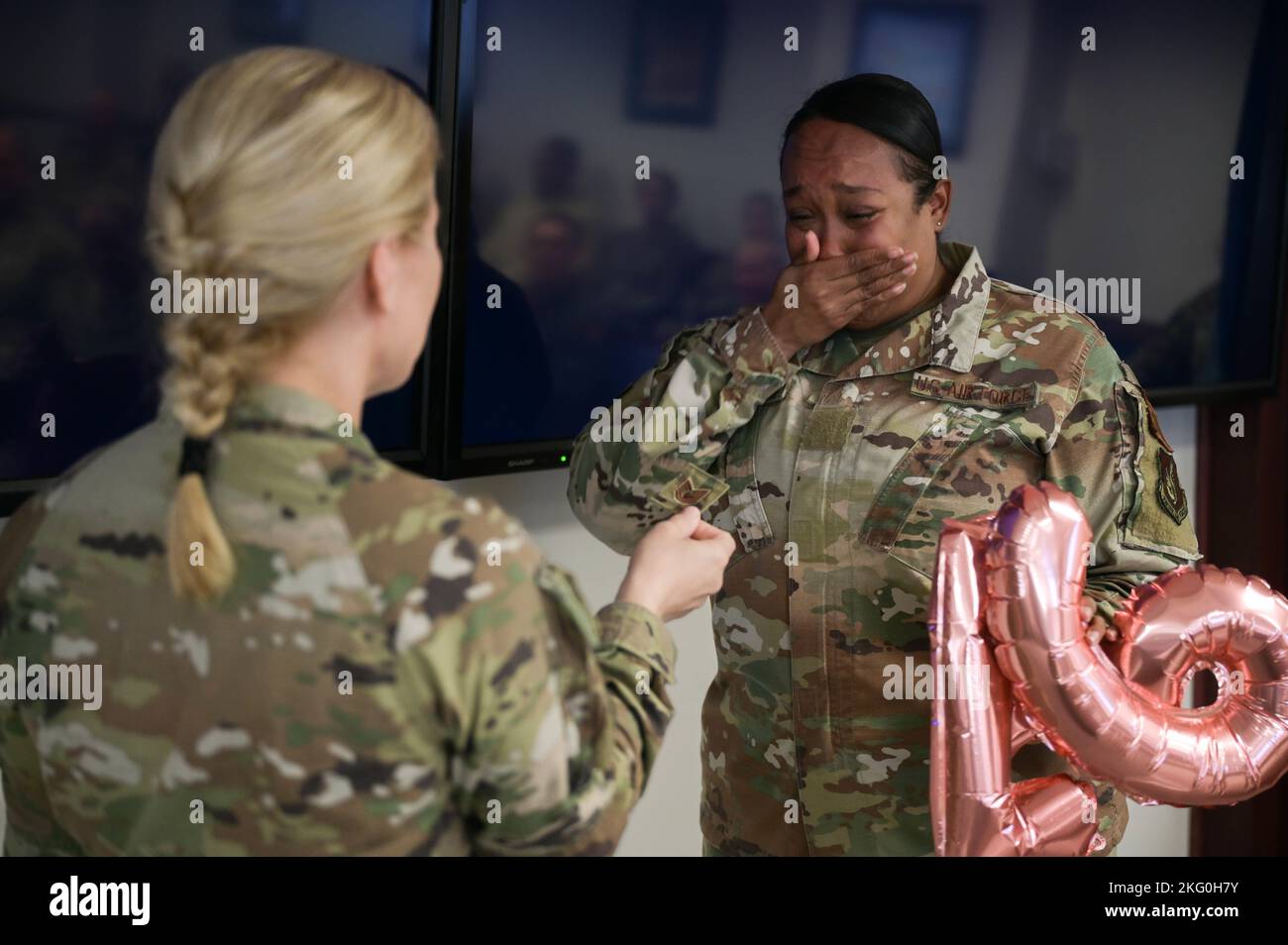 Col. Michele Lo Bianco, 15th Wing commander, hands a technical sergeant ...
