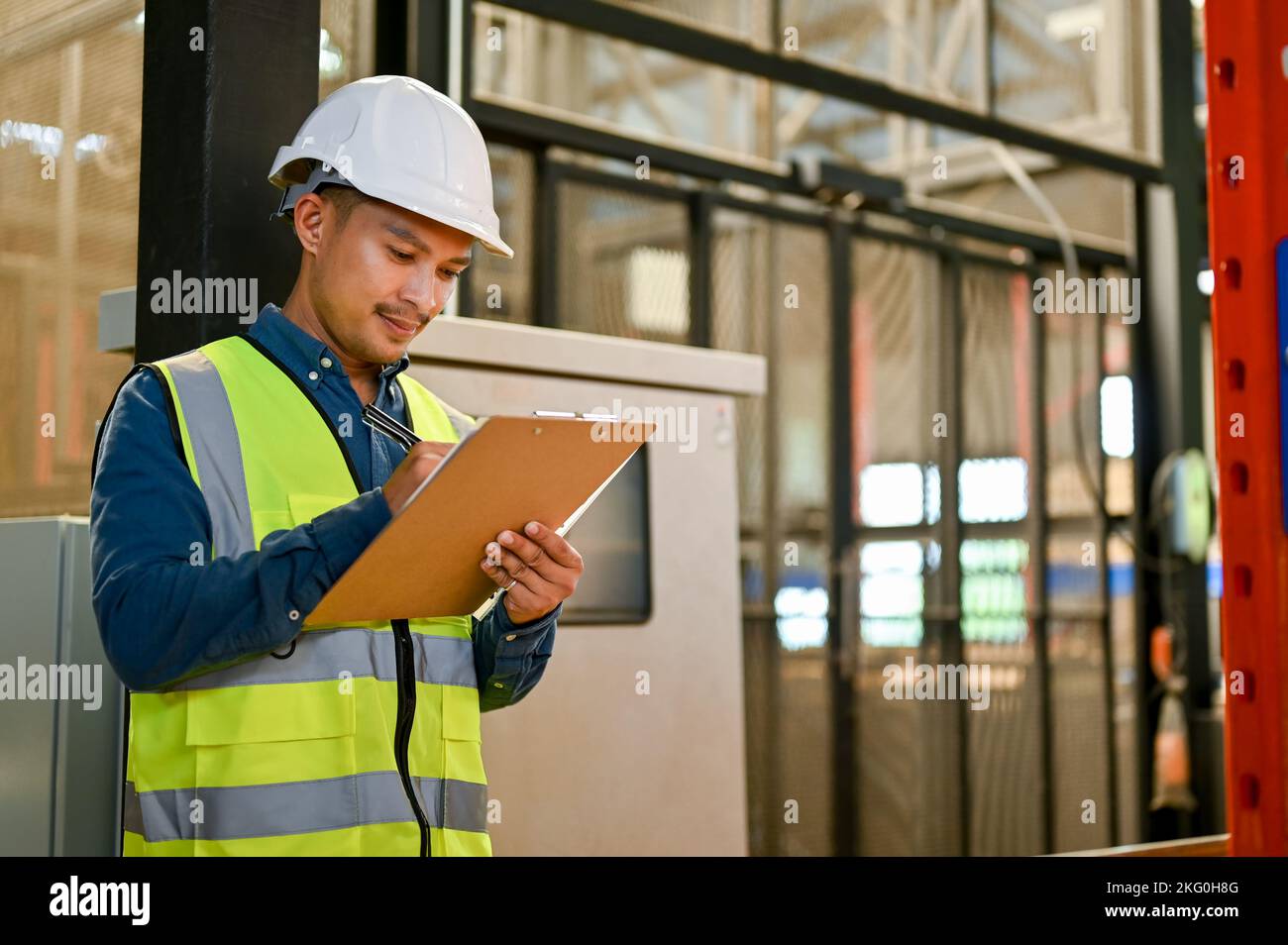 Professional and smart millennial Asian male industrial engineer or ...