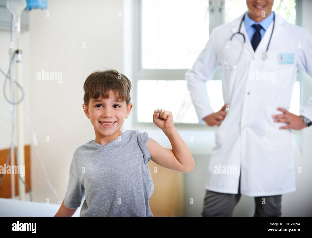First place for the strongest patient. an adorable young boy flexing ...