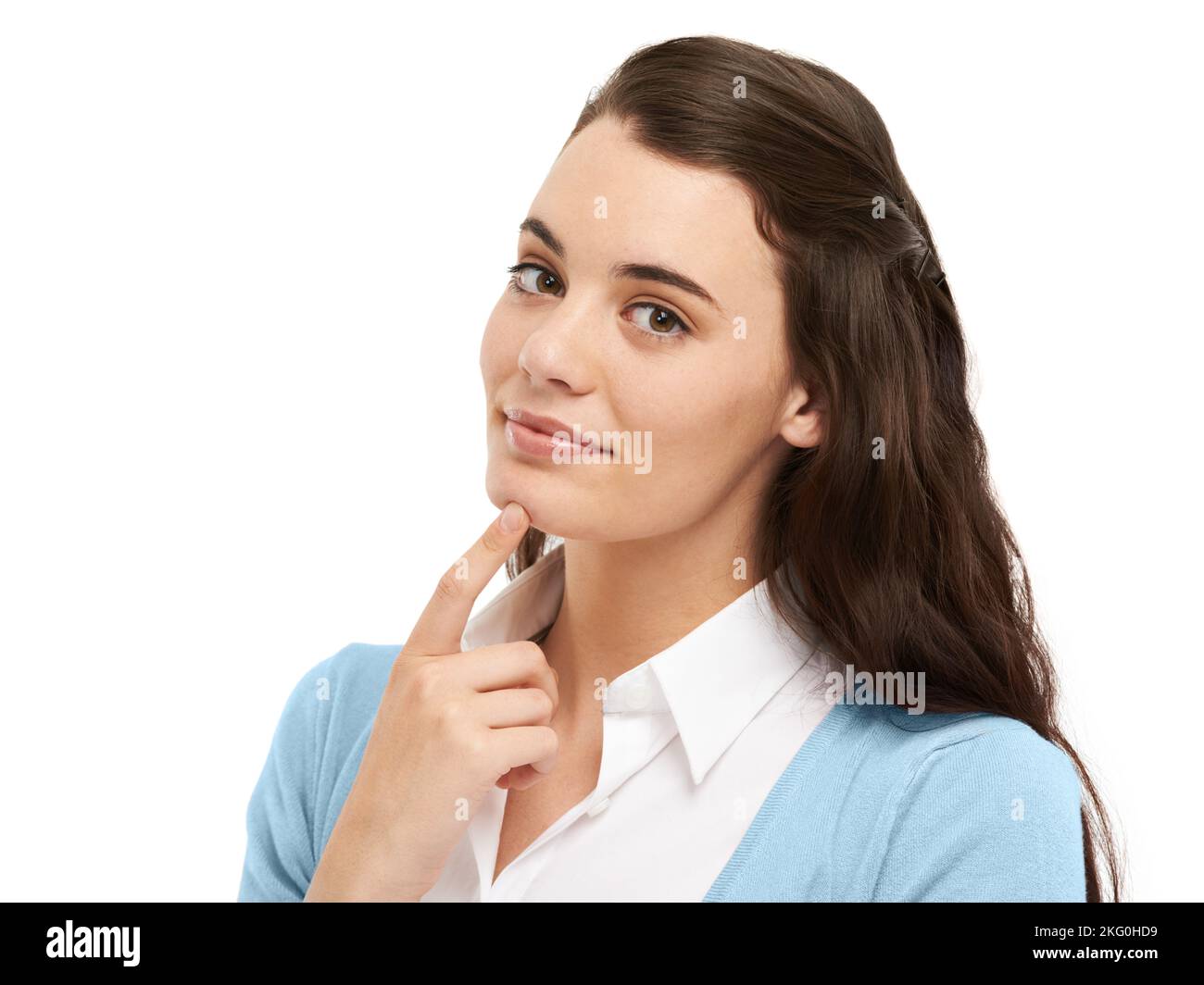 Considering her future. Lovely young woman with her finger on her chin ...